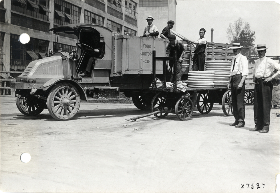 Men unloading tires from Kelly-Springfield truck at Ford Motor Company ...