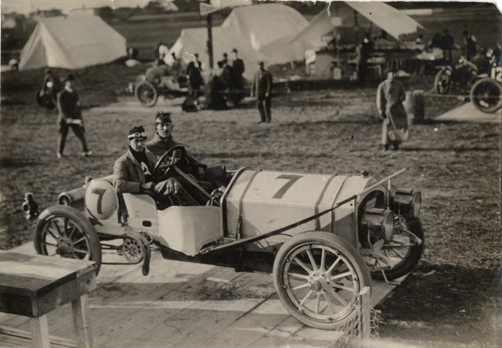 Driver and passenger in racecar, 1908 Brighton Beach races | DPL DAMS