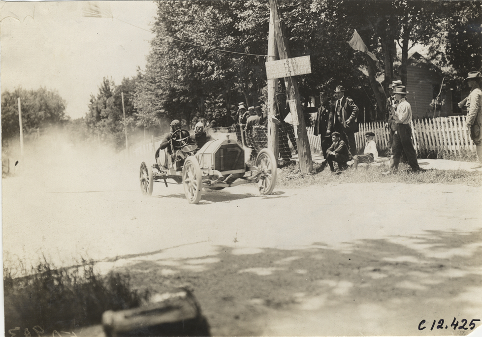 Driver and passenger in racecar, 1909 Crown Point races | DPL DAMS