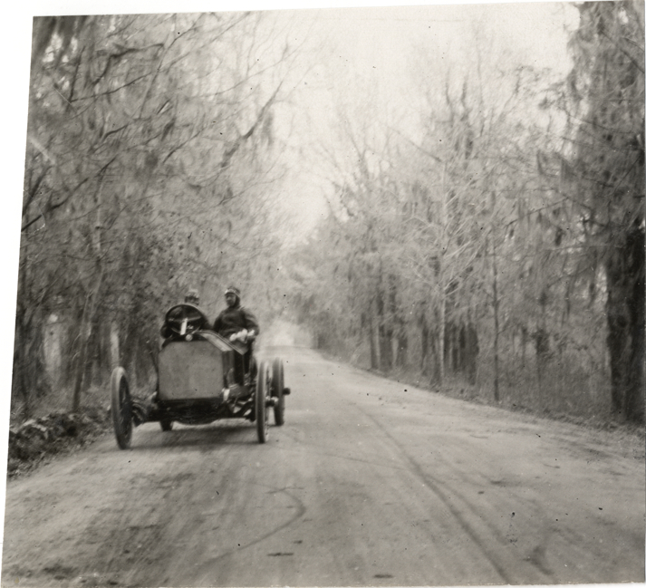 Driver and passenger in racecar, 1908 Grand Prize races | DPL DAMS