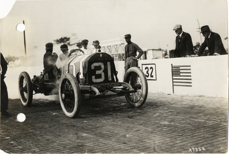 Louis Disbrow and passenger in Case racecar leaving pits, 1913 ...