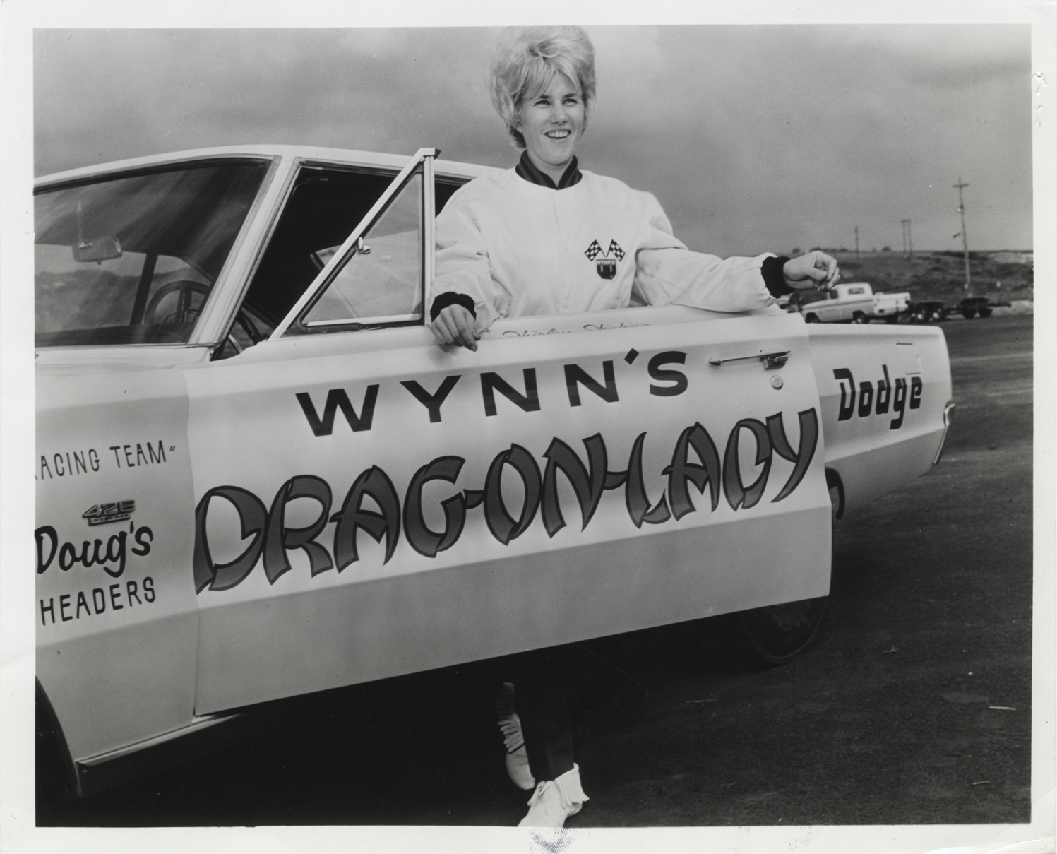 Shirley Shahan posing with 1967 Dodge Coronet drag racing car | DPL DAMS