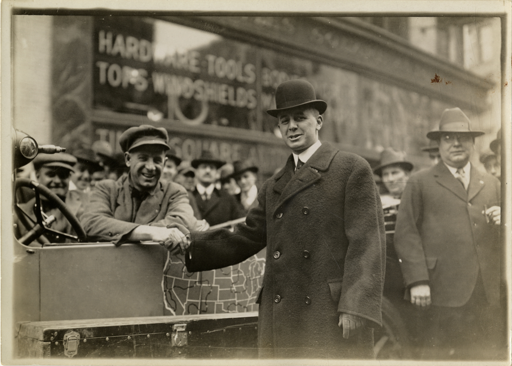 J. Walter Drake greeting Hupmobile automobile at Grand Central Palace ...