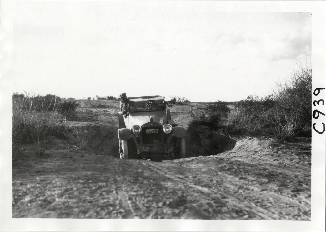Hupmobile automobile in pit on desert road, Hupmobile United American ...