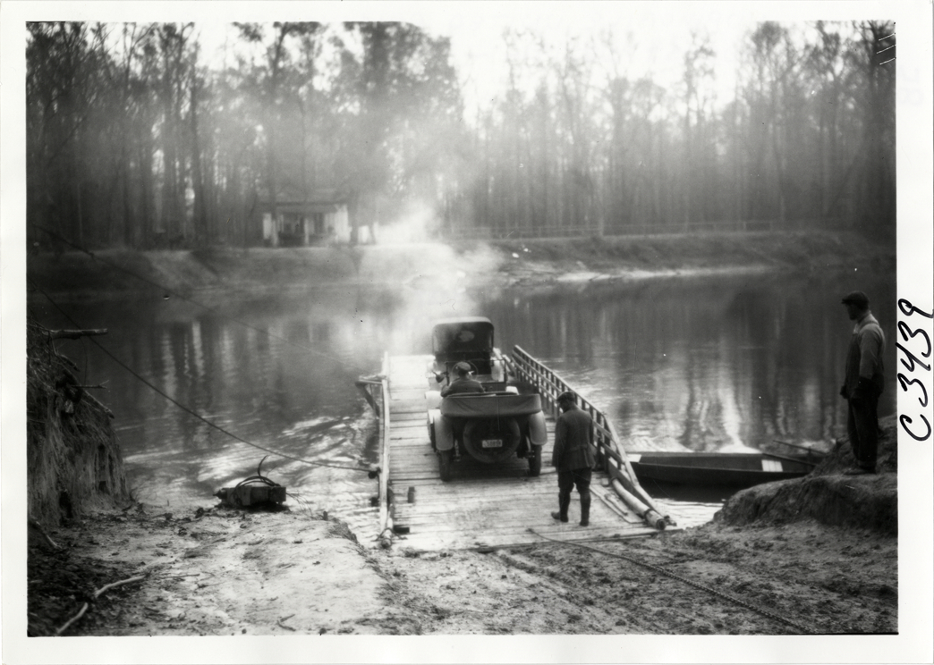 Hupmobile automobile and unidentified automobile on river ferry leaving ...