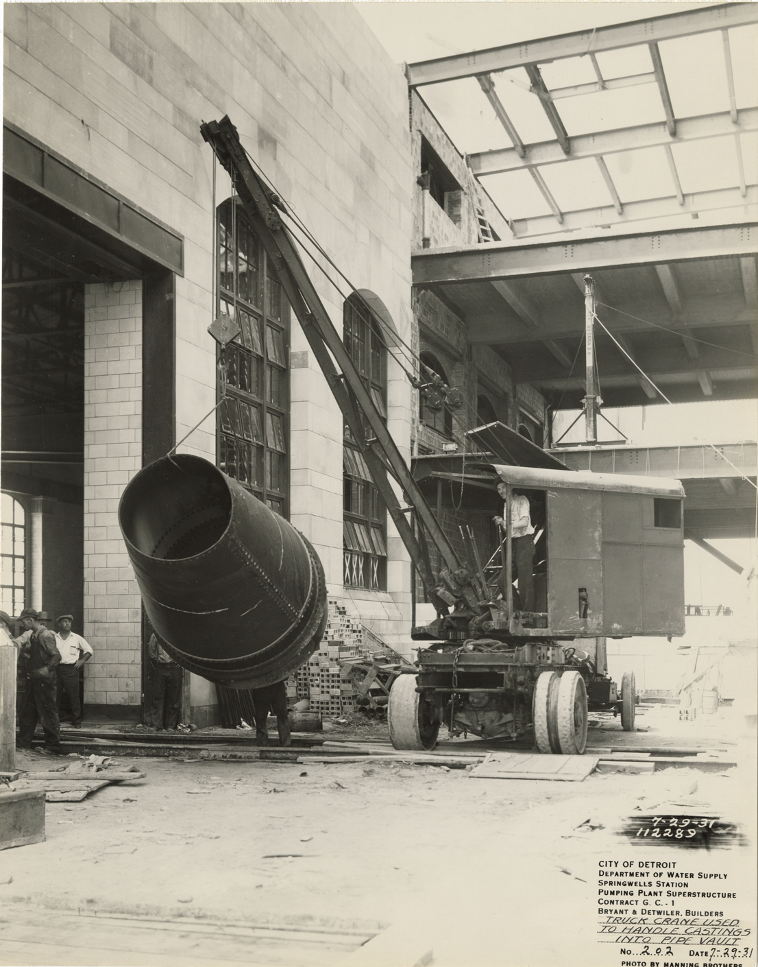 Crane lifting casting, pumping plant superstructure during construction ...