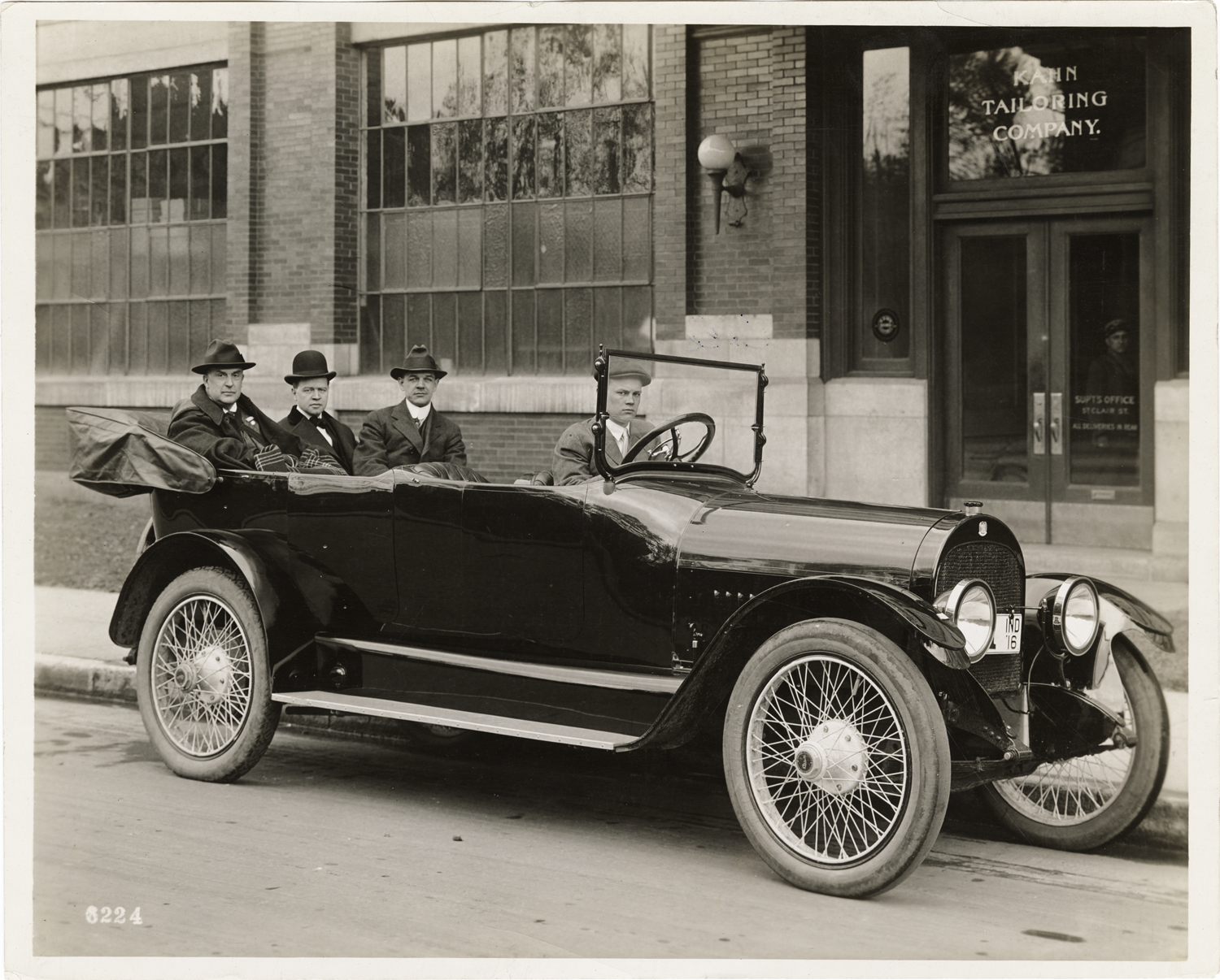 Thomas Mott Osborne and motorists posing in a Cole Eight automobile ...
