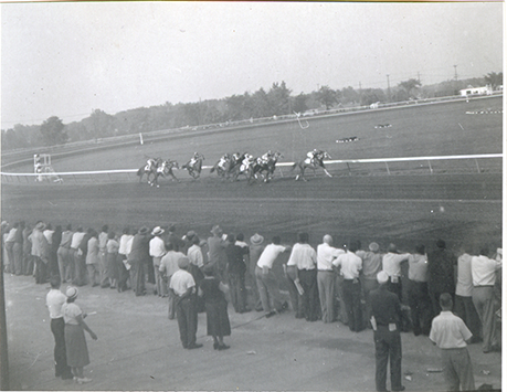 Spectators watching horse race, Hazel Park Raceway | DPL DAMS