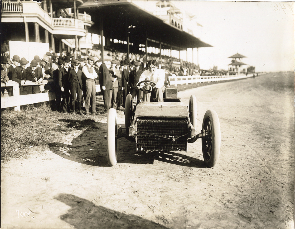 Barney Oldfield posing in a 1908 Winton Bullet no. 2 racecar | DPL DAMS